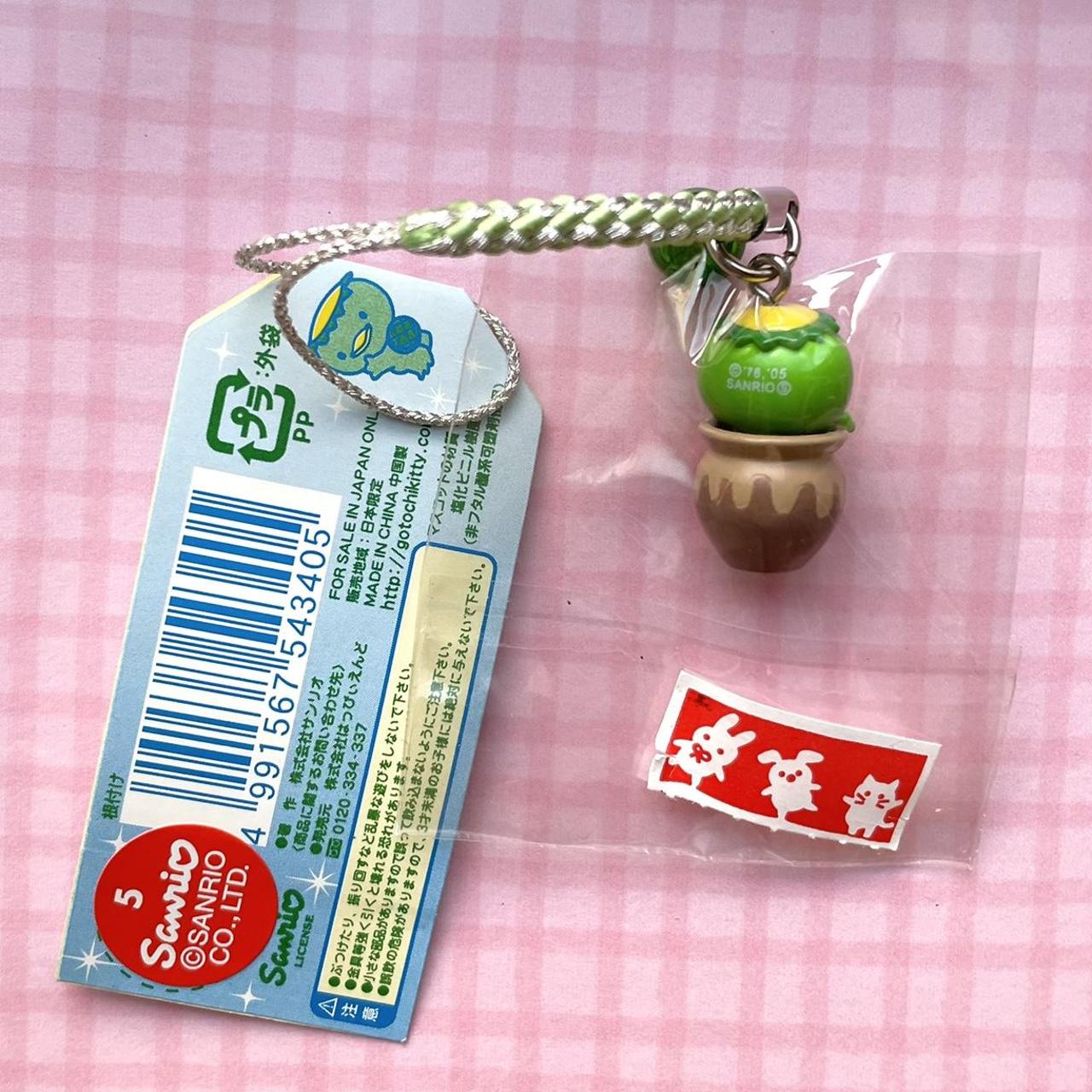 hello kitty wearing a green tono kappa costume... - Depop