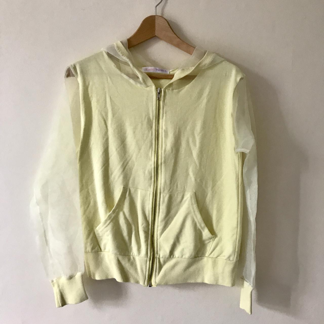 Pastel Yellow zip-up jumper with sheer sleeves and... - Depop