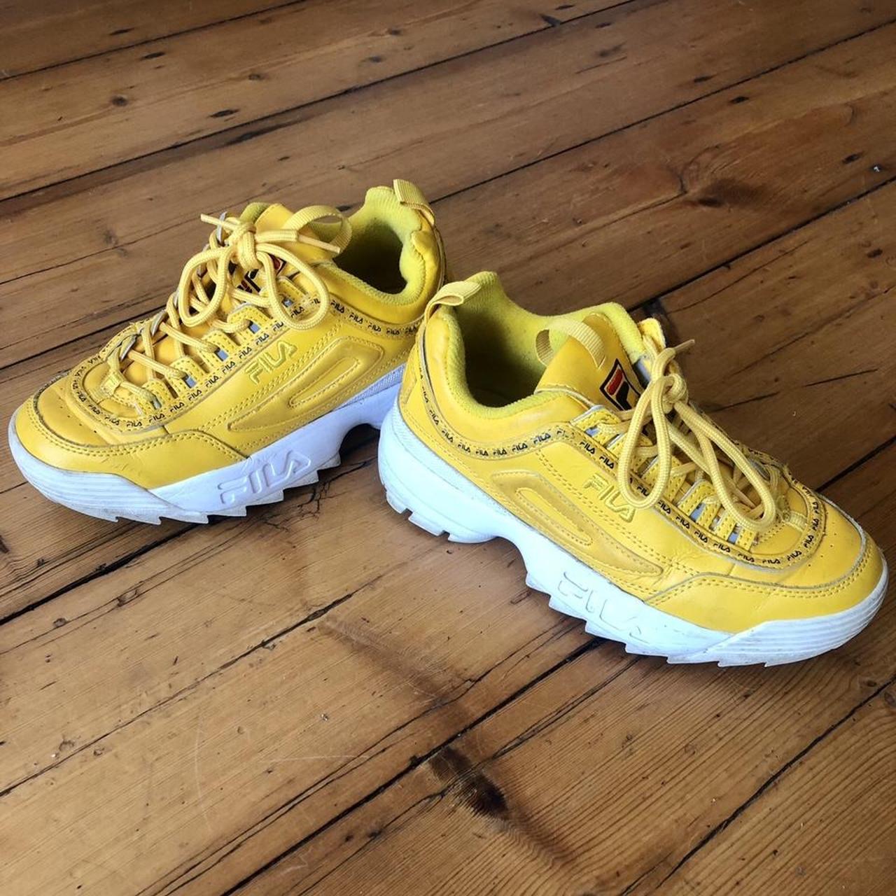Yellow FILA sports trainers. Womens size 4. Padded... - Depop