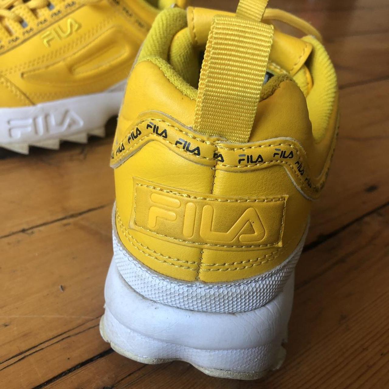 Yellow FILA sports trainers. Womens size 4. Padded... - Depop
