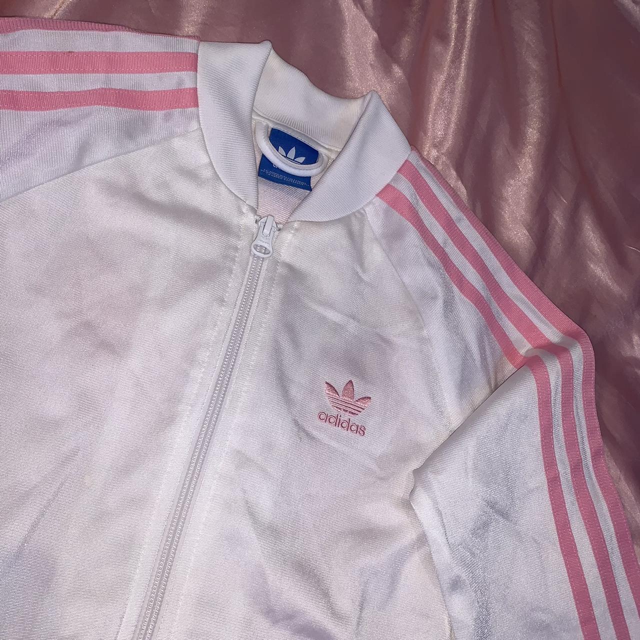 Pink and white track Adidas jacket. Size 11-12 but... - Depop