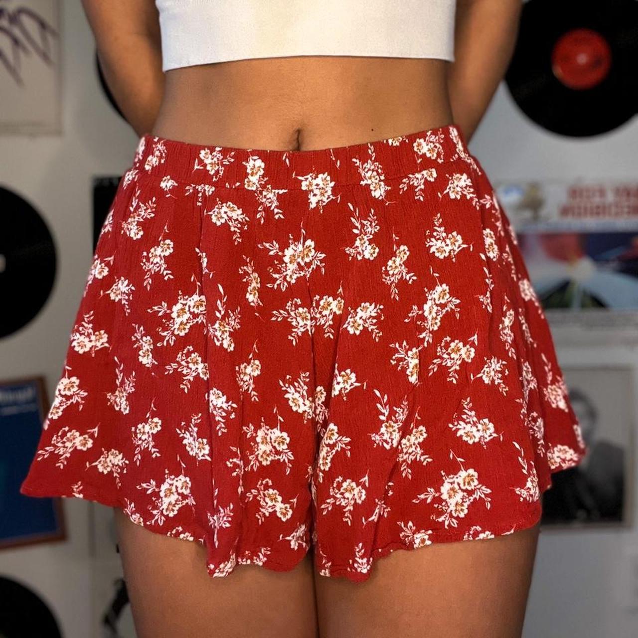 adorable red ruffley shorts with a white floral... - Depop