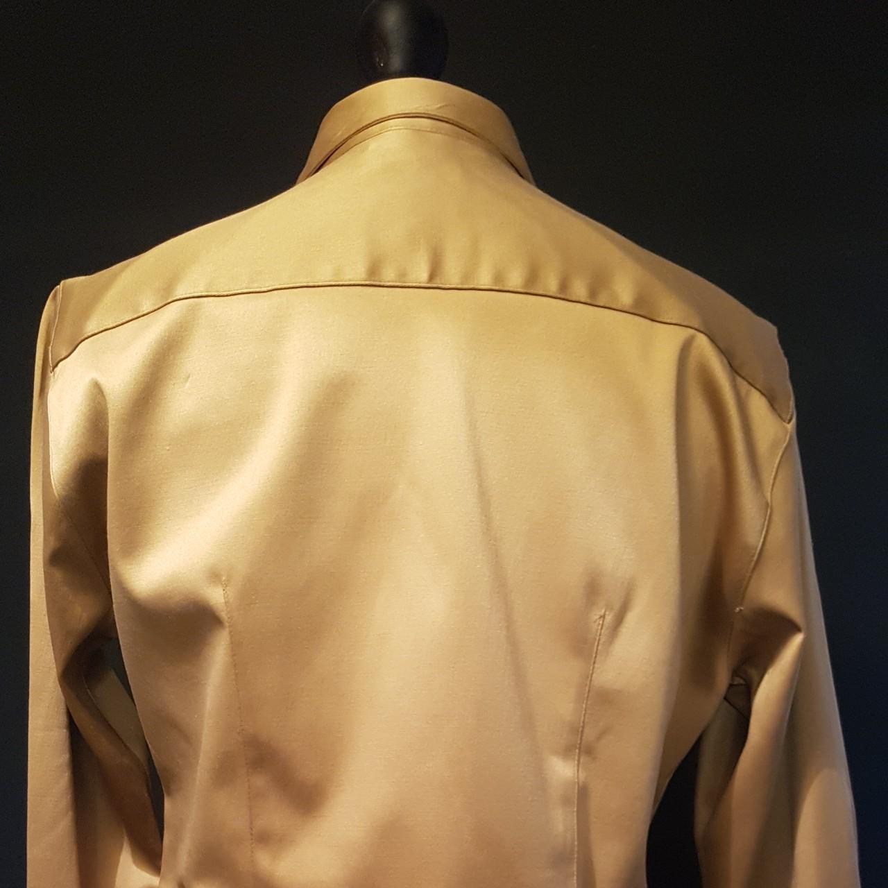 Golden/bronze shirt. Slight biro mark on pocket and... - Depop