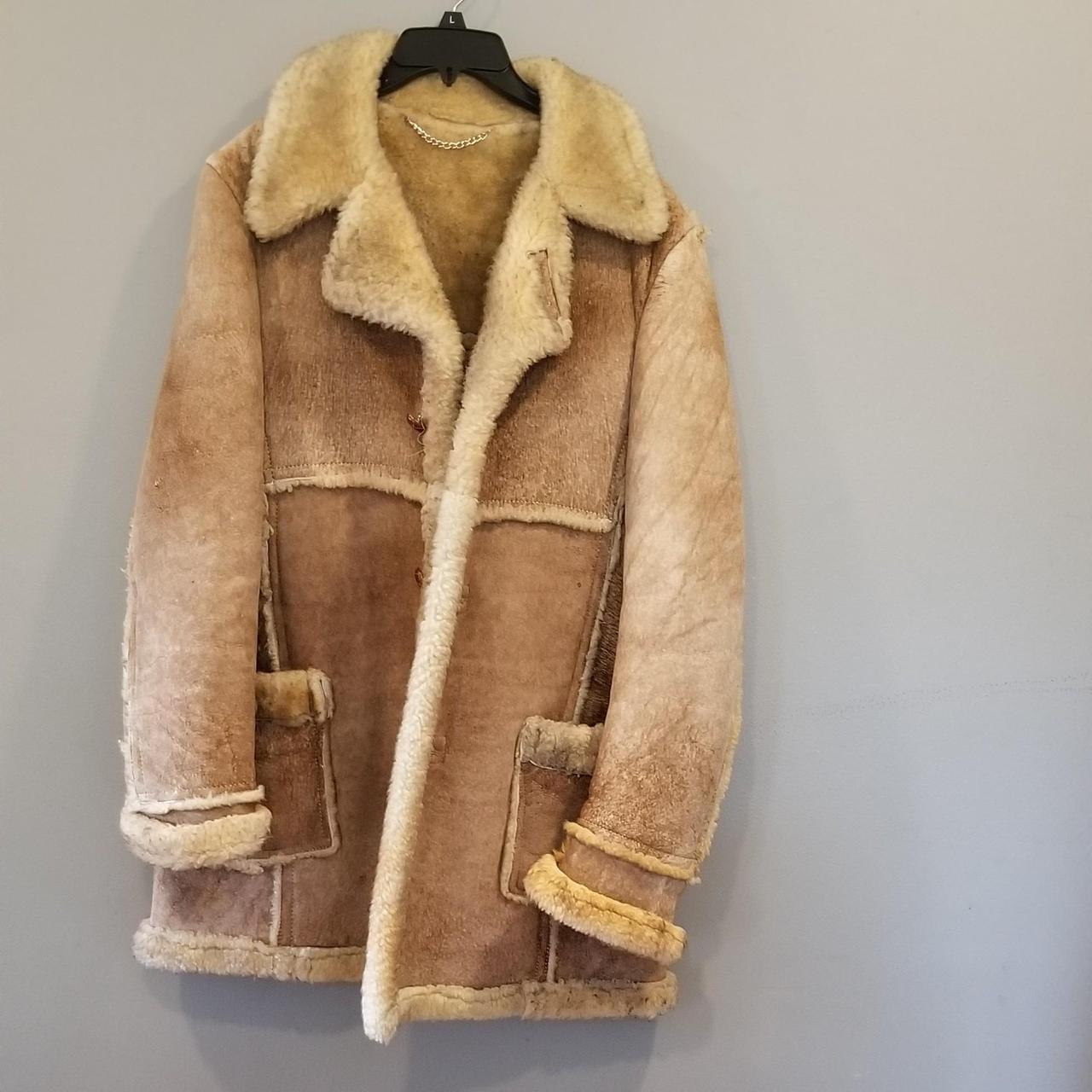 A men's tan shearling coat has some minor tears... - Depop