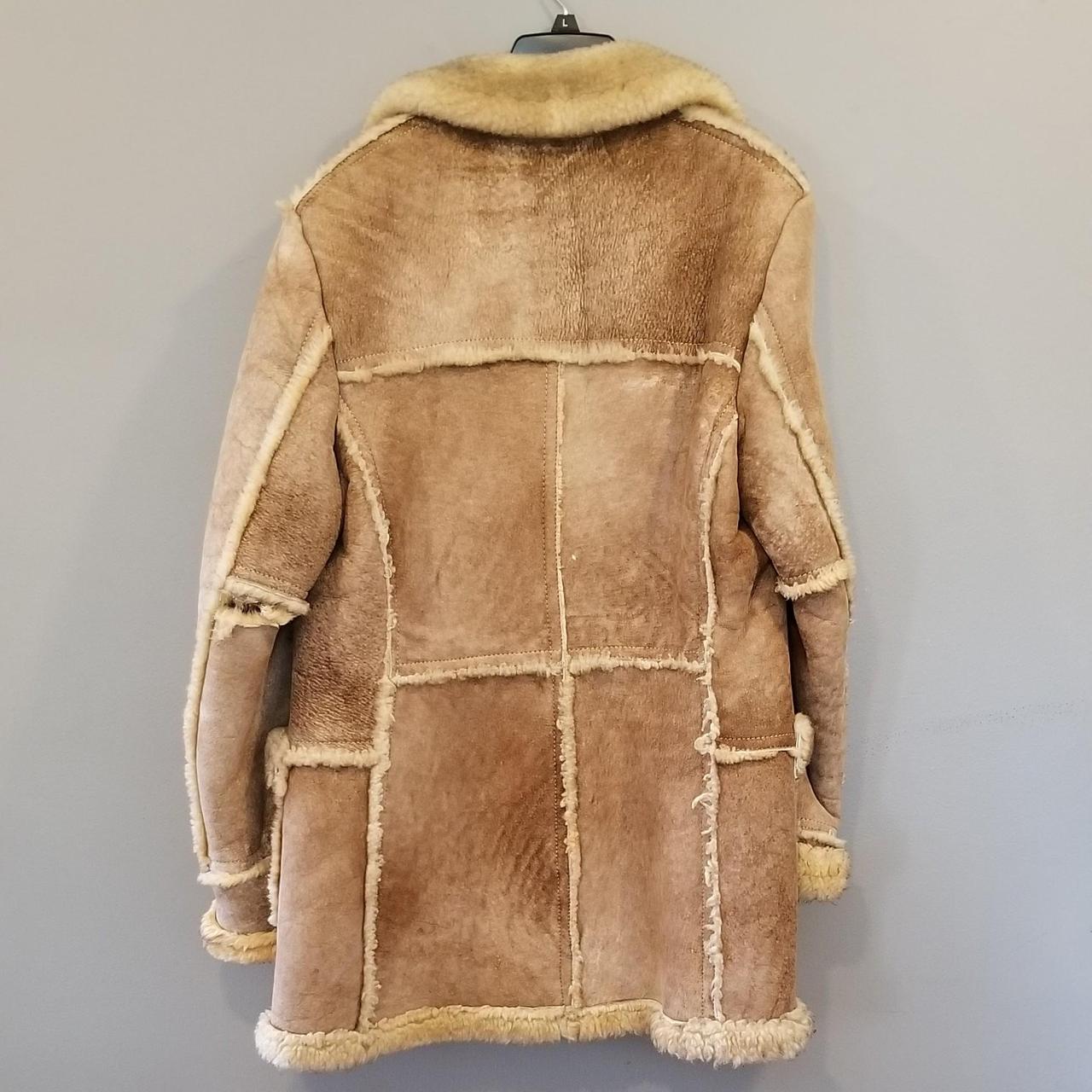 A men's tan shearling coat has some minor tears... - Depop