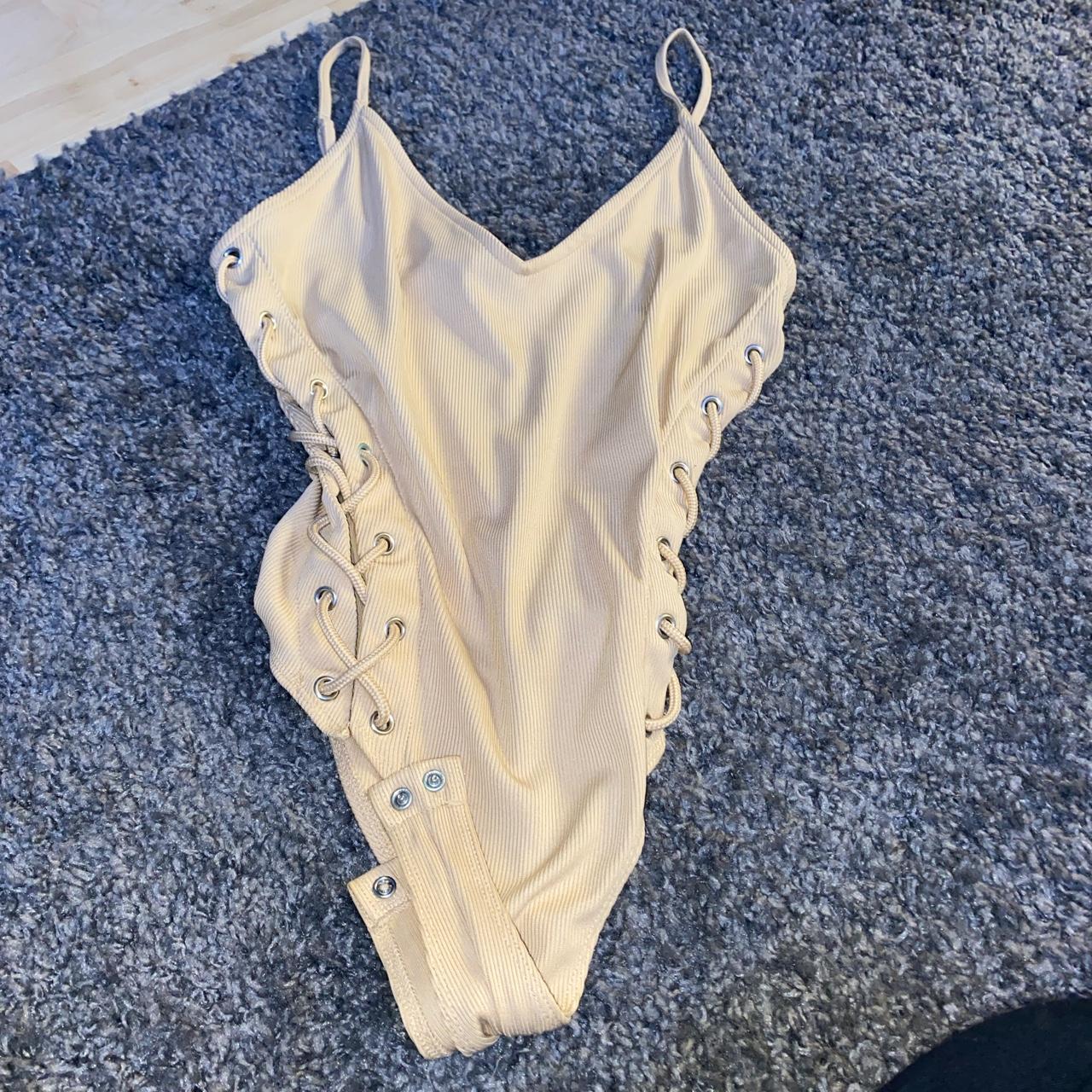 Nude forever 21 body suit with lace up sides. Never... - Depop