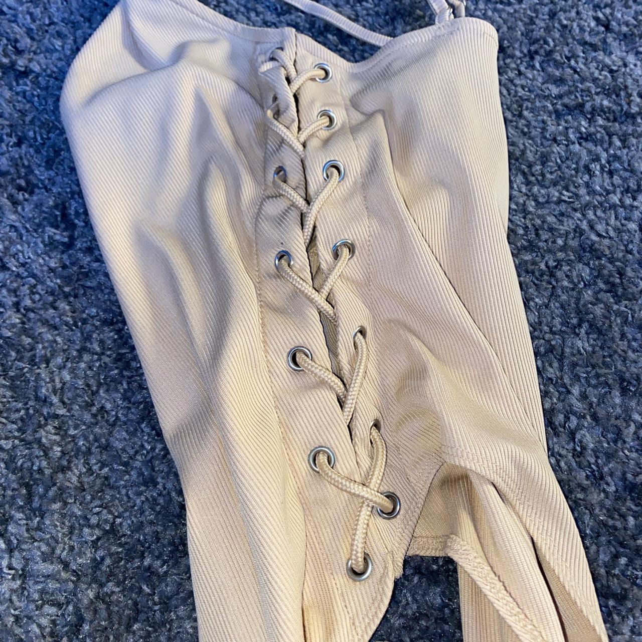 Nude forever 21 body suit with lace up sides. Never... - Depop