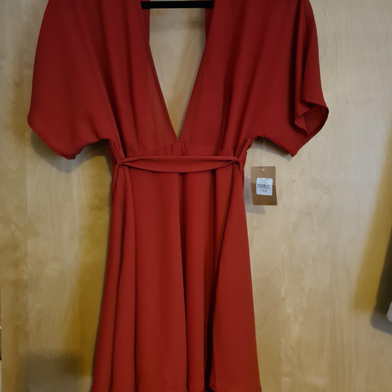 Lovely brick red dress. It has a deep V in the front... - Depop