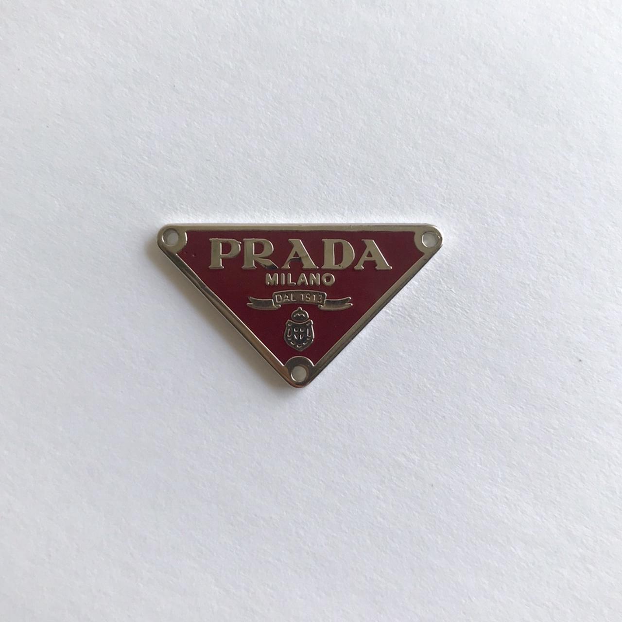 Burgundy Prada Pendant Silver finish. Can be turned... - Depop