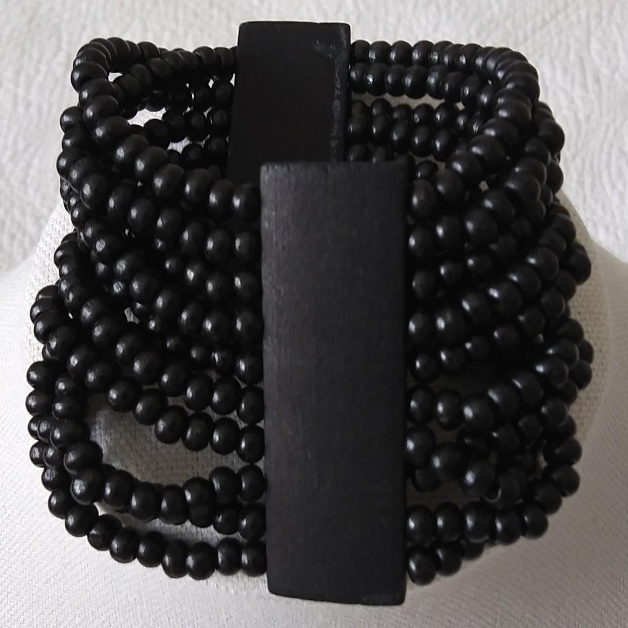 Black Beaded cuff-style stretch wood... - Depop