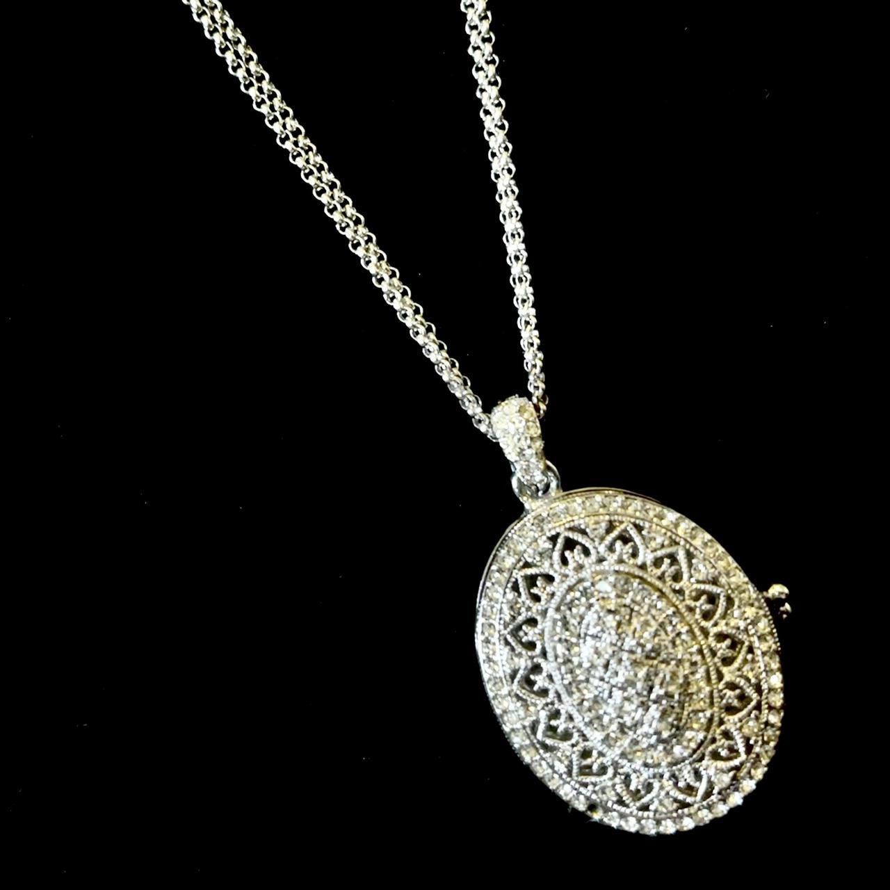 Silver toned locket. Long chain. Possibly silver.... - Depop