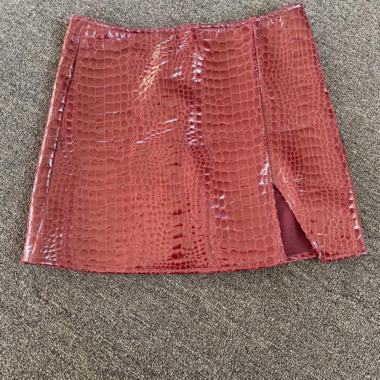 Red snake skin mini skirt with slit from Motel... - Depop