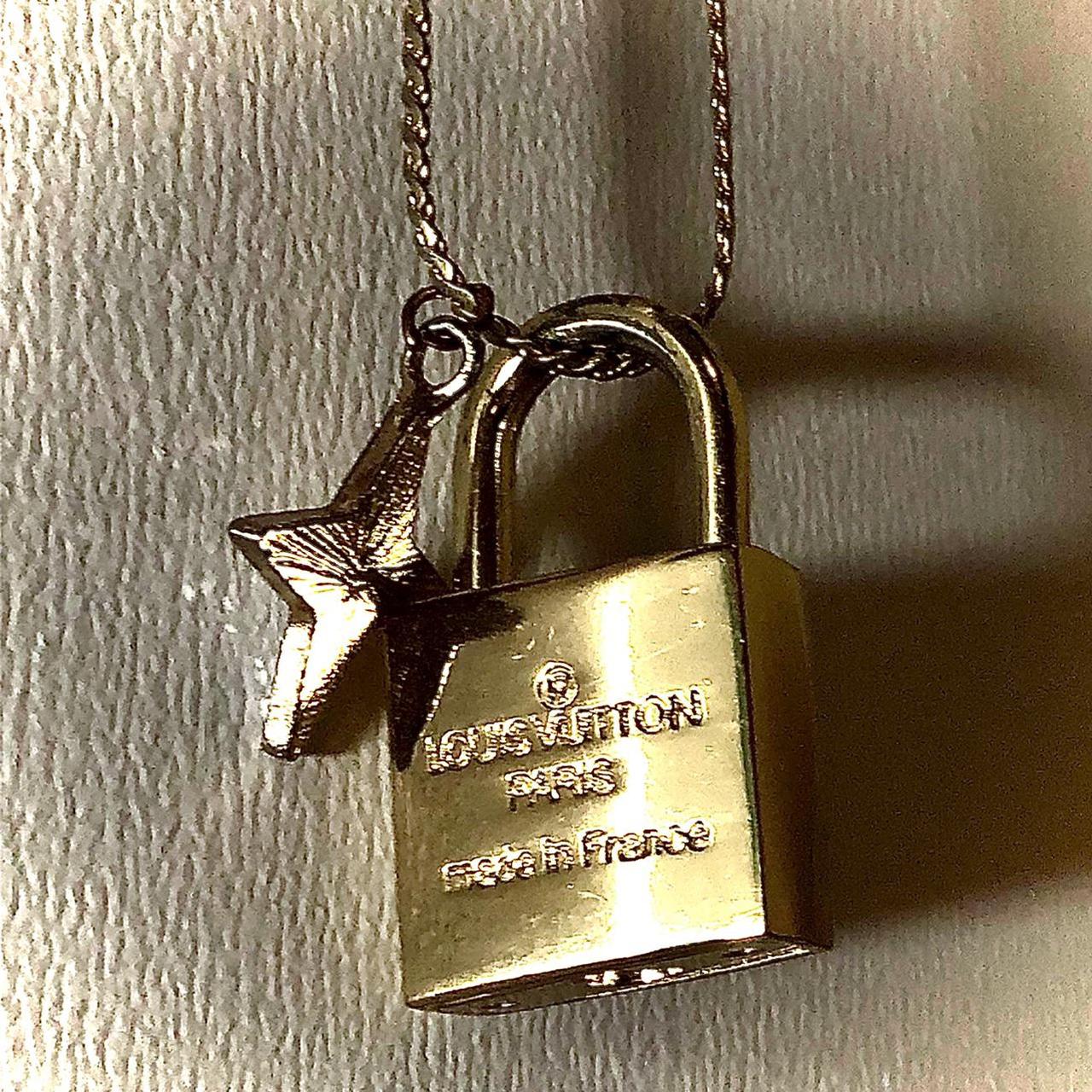 LV lock necklace. Gold chain with added cz charm.... - Depop