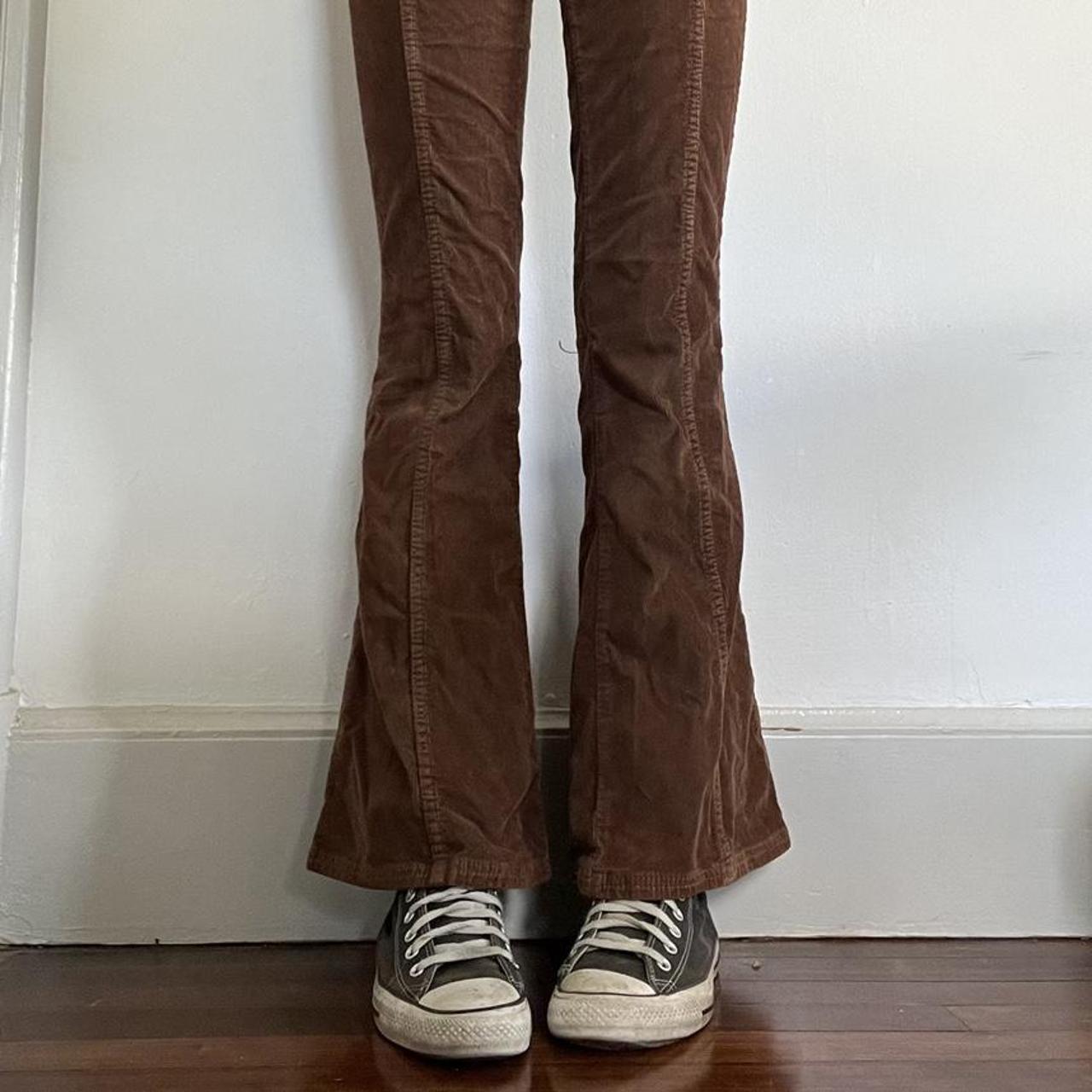low-waisted brown corduroy flare pants with side... - Depop