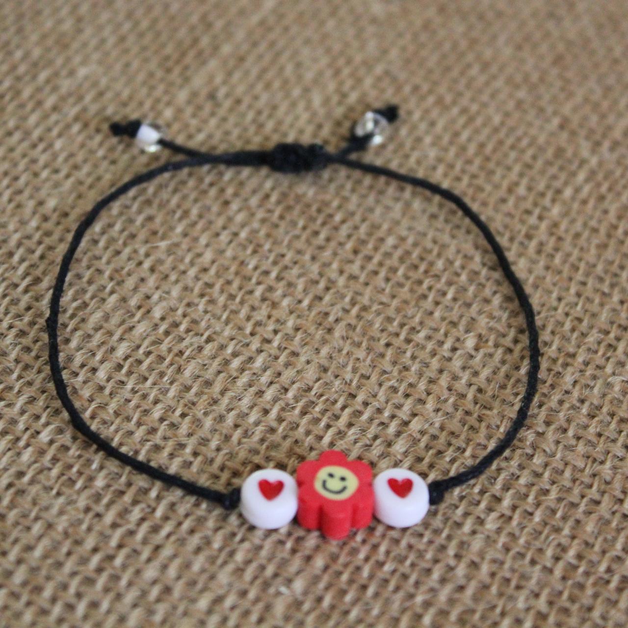 Smiley face flower charm with heart charms bracelet... - Depop
