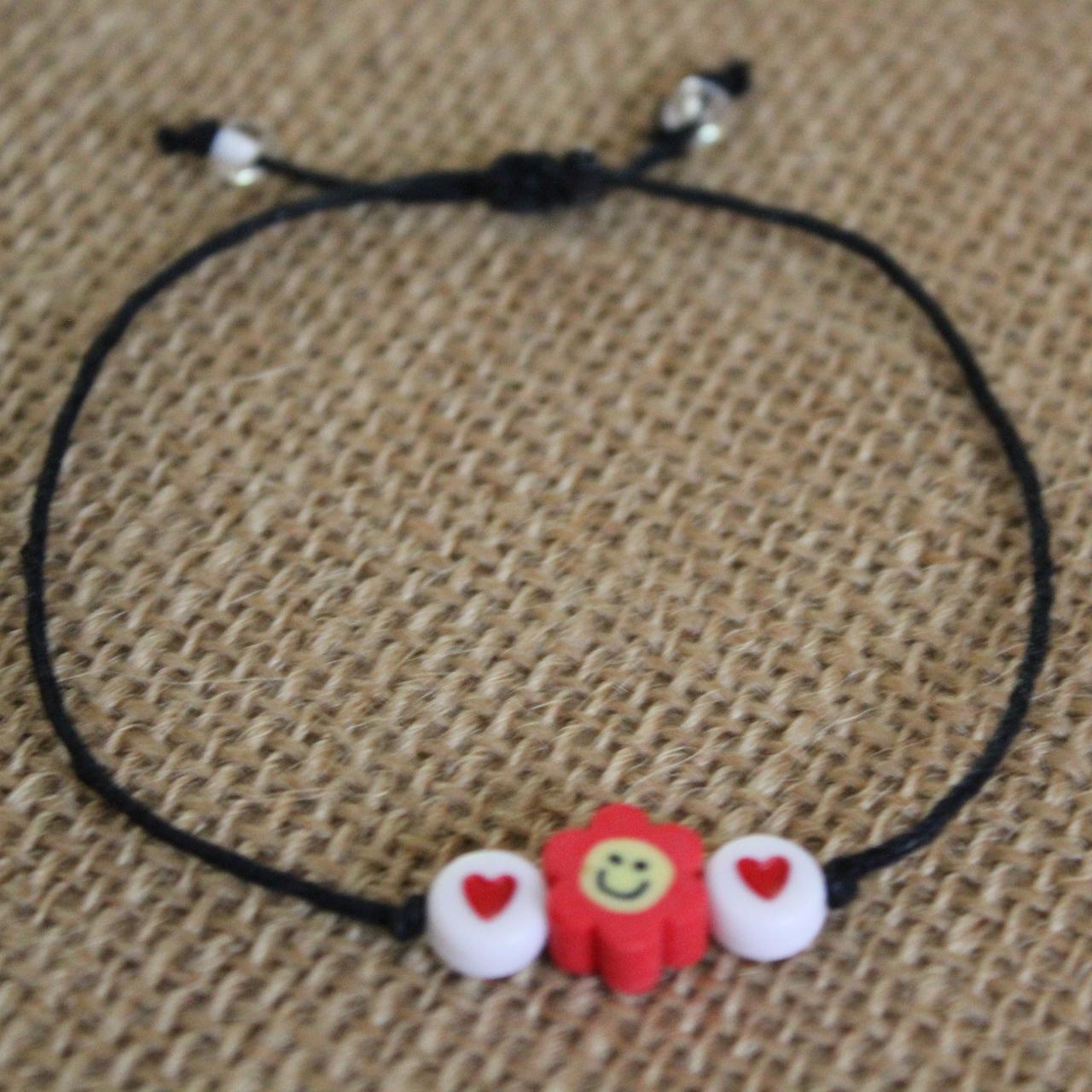 Smiley face flower charm with heart charms bracelet... - Depop