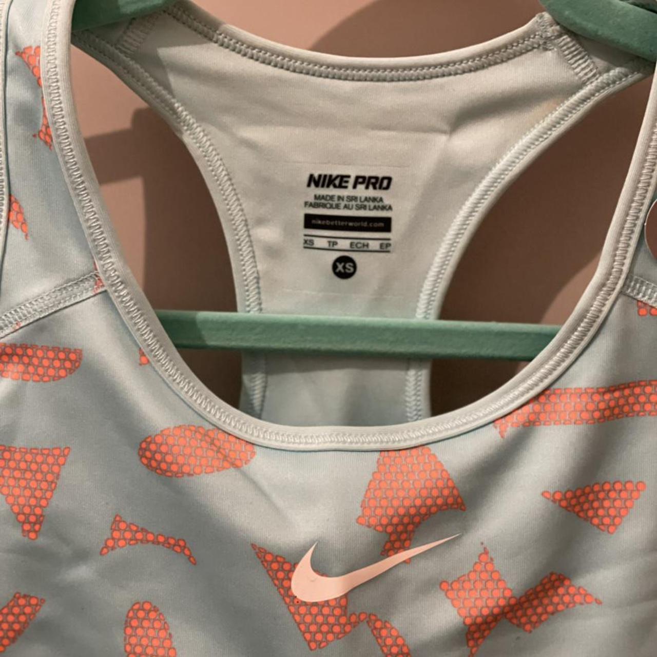 Nike pro baby blue and orange patterned sports bra... - Depop