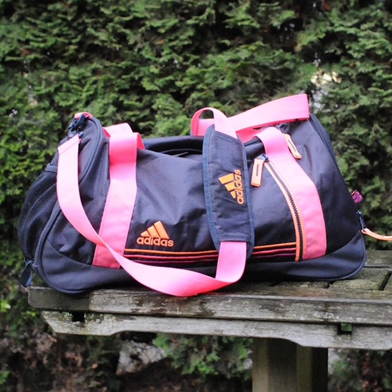 ADIDAS pink and black duffle bag. Some orange neon... - Depop