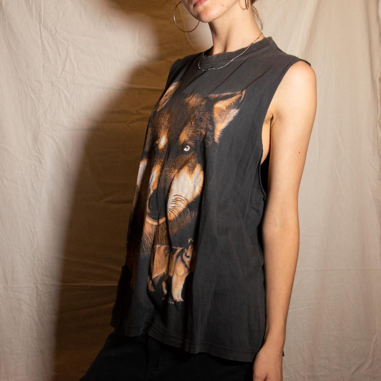 SLEEVELESS WOLF TOP width (pit to pit) - 19... - Depop