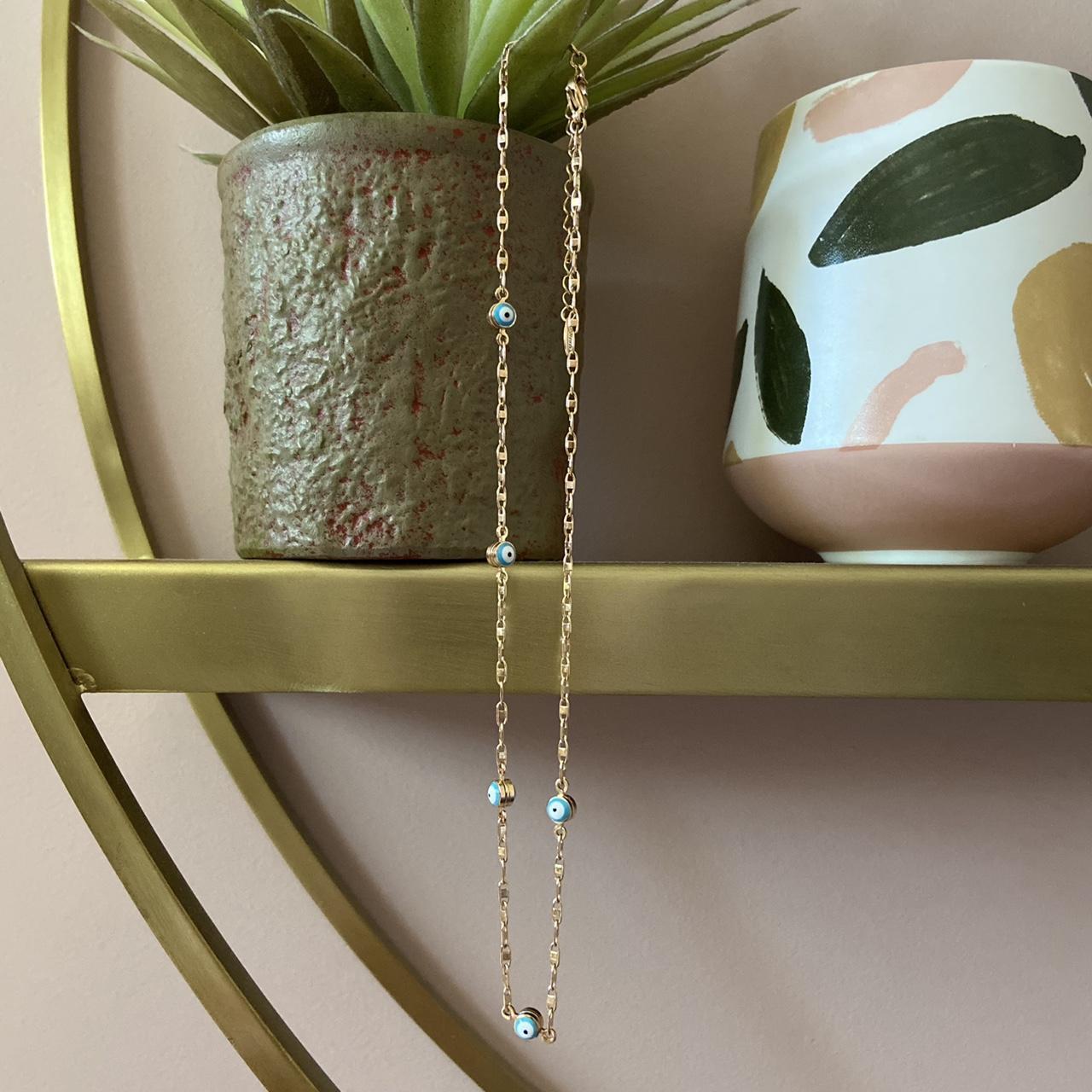 Turkish Evil Eye-esque gold necklace, super dainty... - Depop