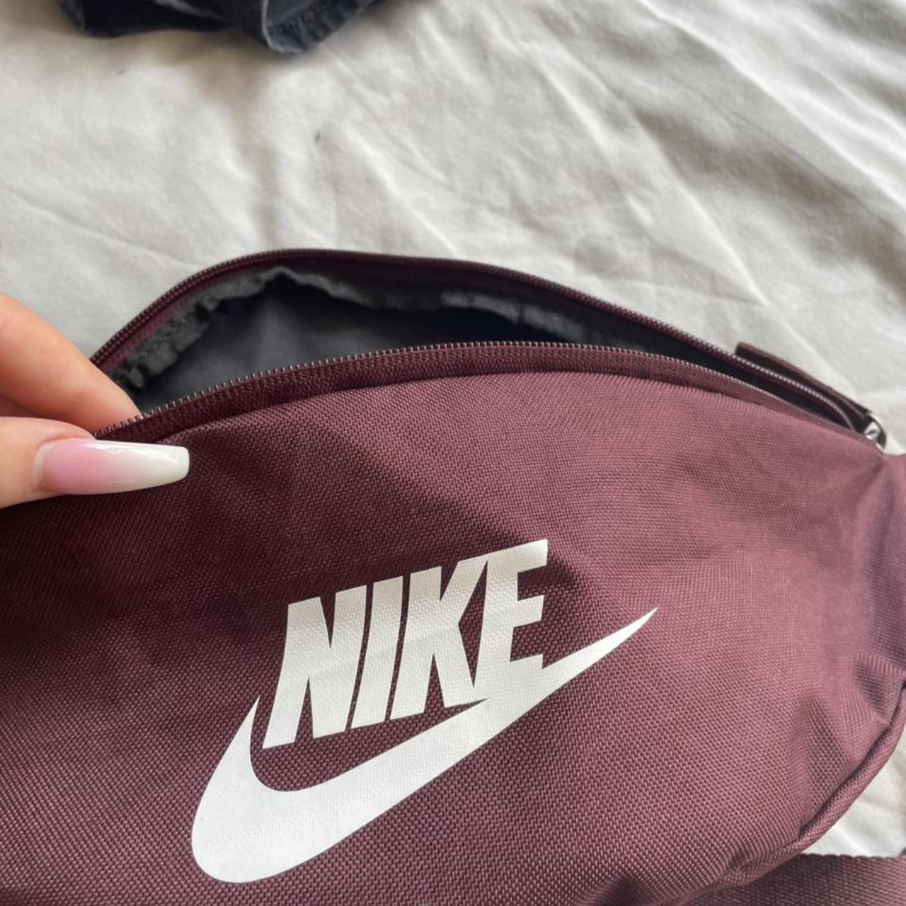 Burgundy Nike bum bag , can fit a a lot of stuff in... - Depop