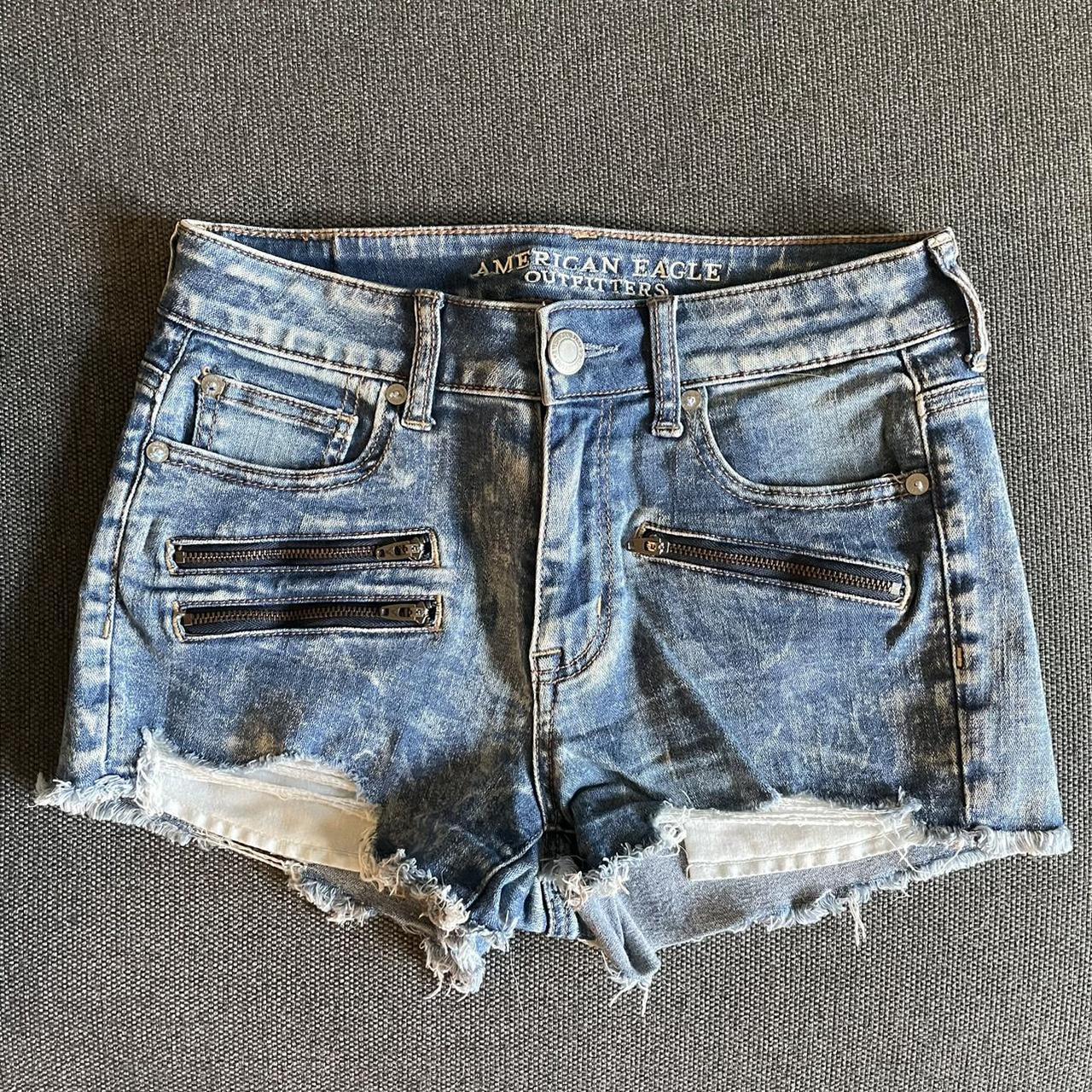 Denim American Eagle cutoffs with acid wash design... - Depop