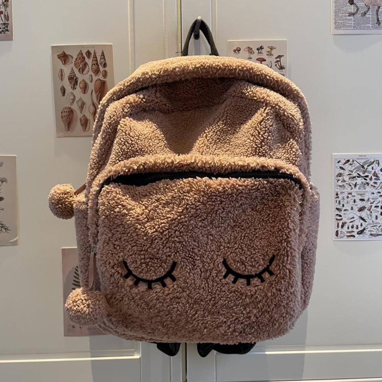 urban outfitters pink borg backpack