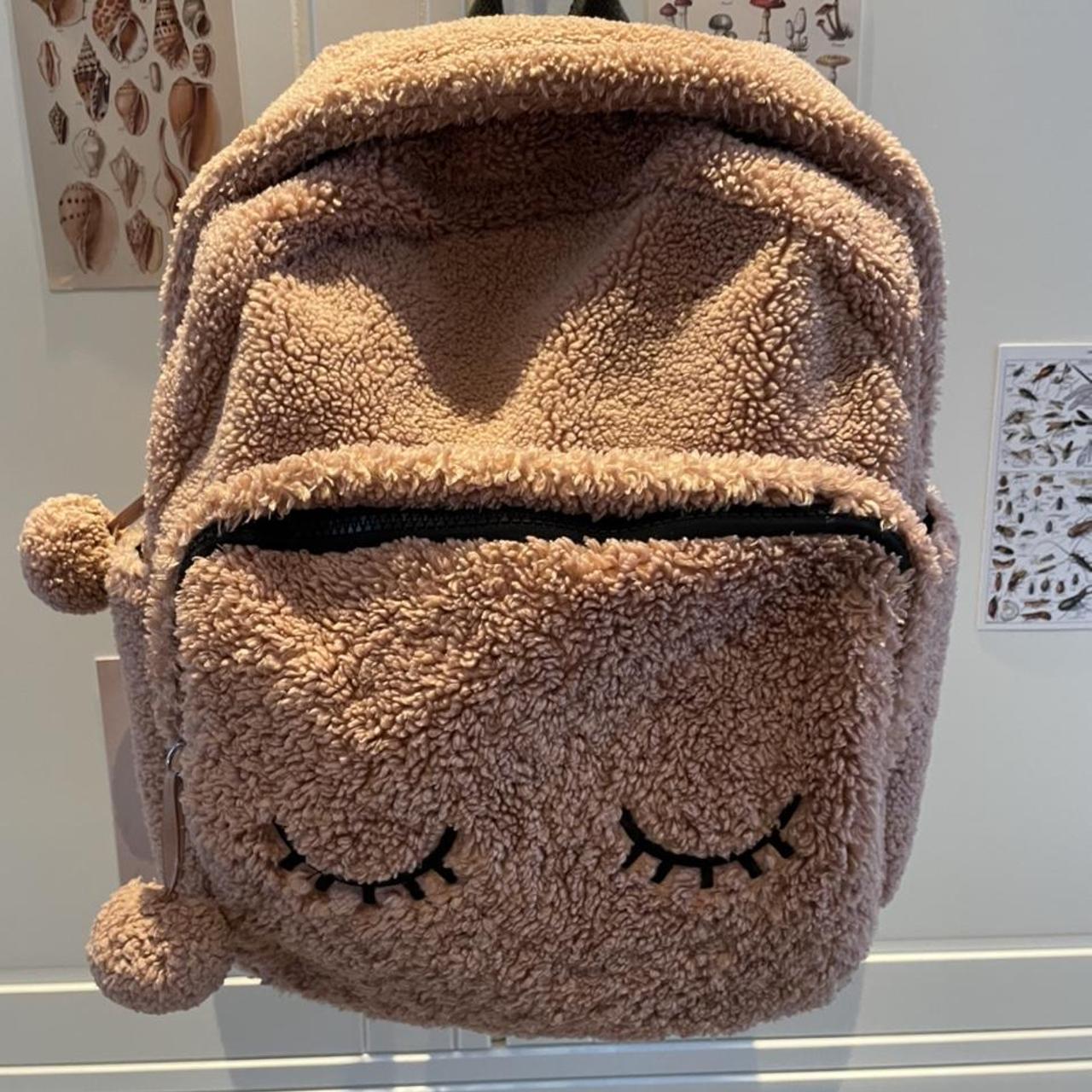 urban outfitters pink borg backpack