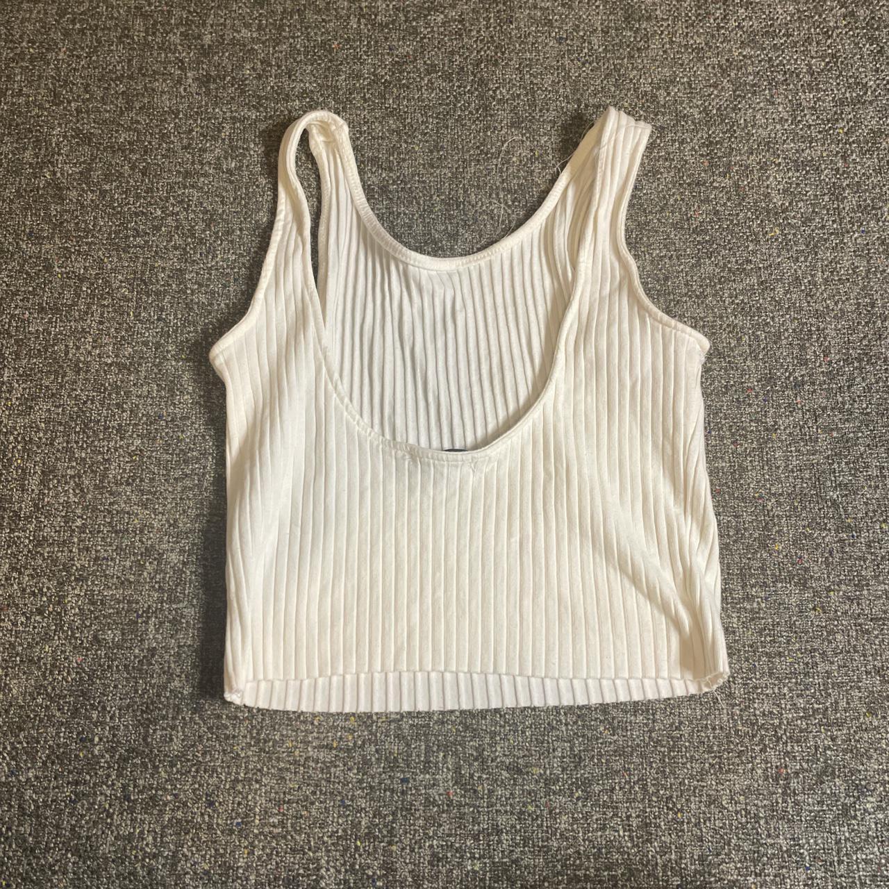 Small crop ribbed tank top. Can fit a size medium... - Depop