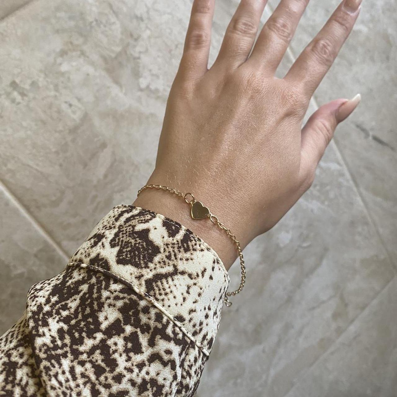 Cute little solid heart bracket with gold cable... - Depop