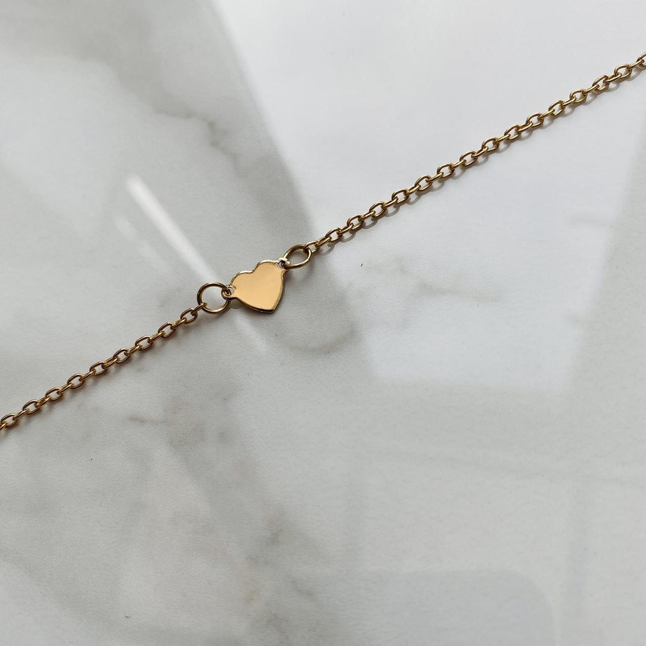 Cute little solid heart bracket with gold cable... - Depop