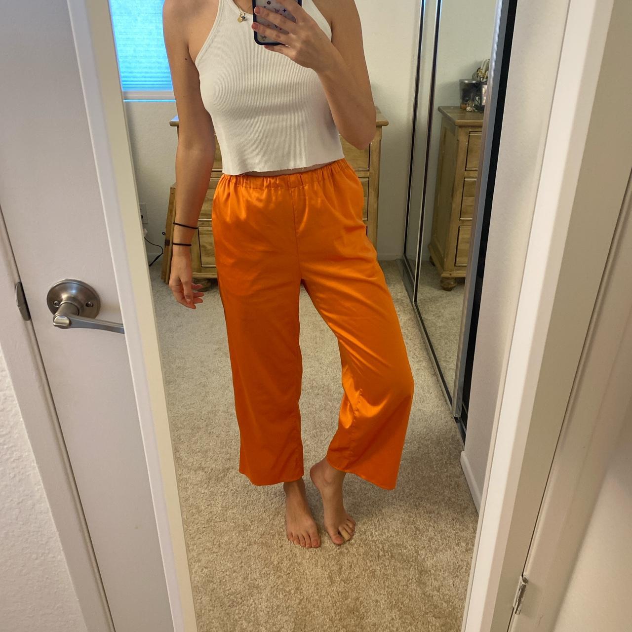 Orange UO pants. The elastic is a little twisted in... - Depop