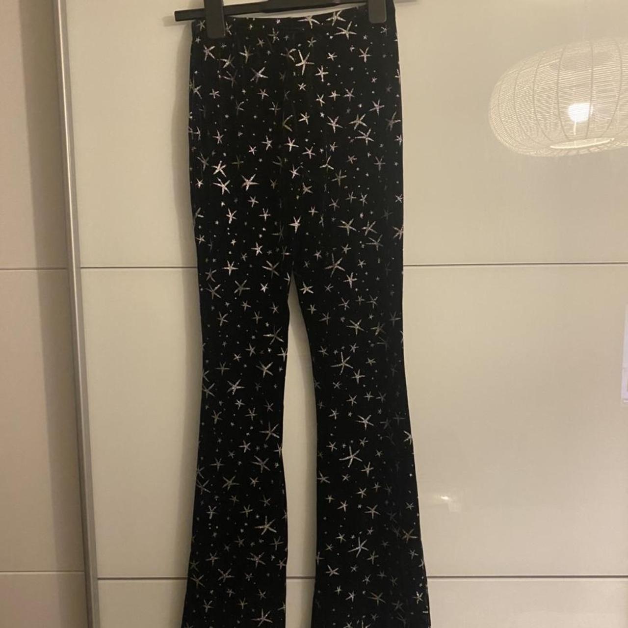- glitter star print black velour flared trousers /... - Depop