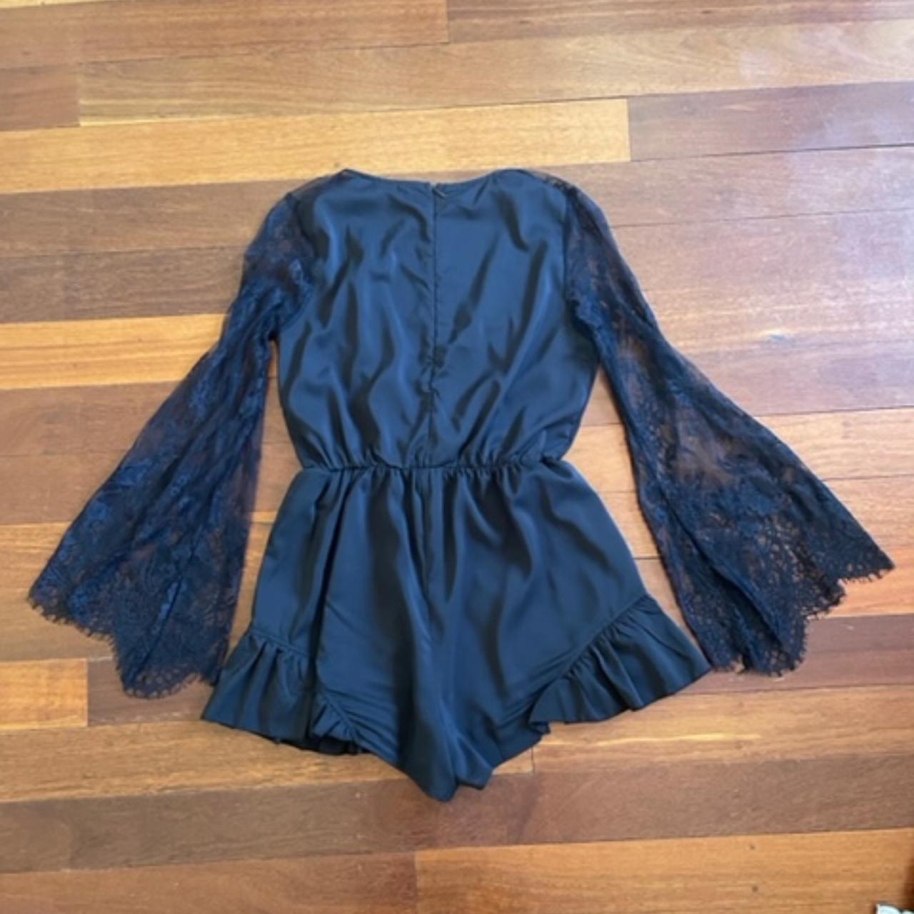 Reverse Chic crossover playsuit has a black base... - Depop