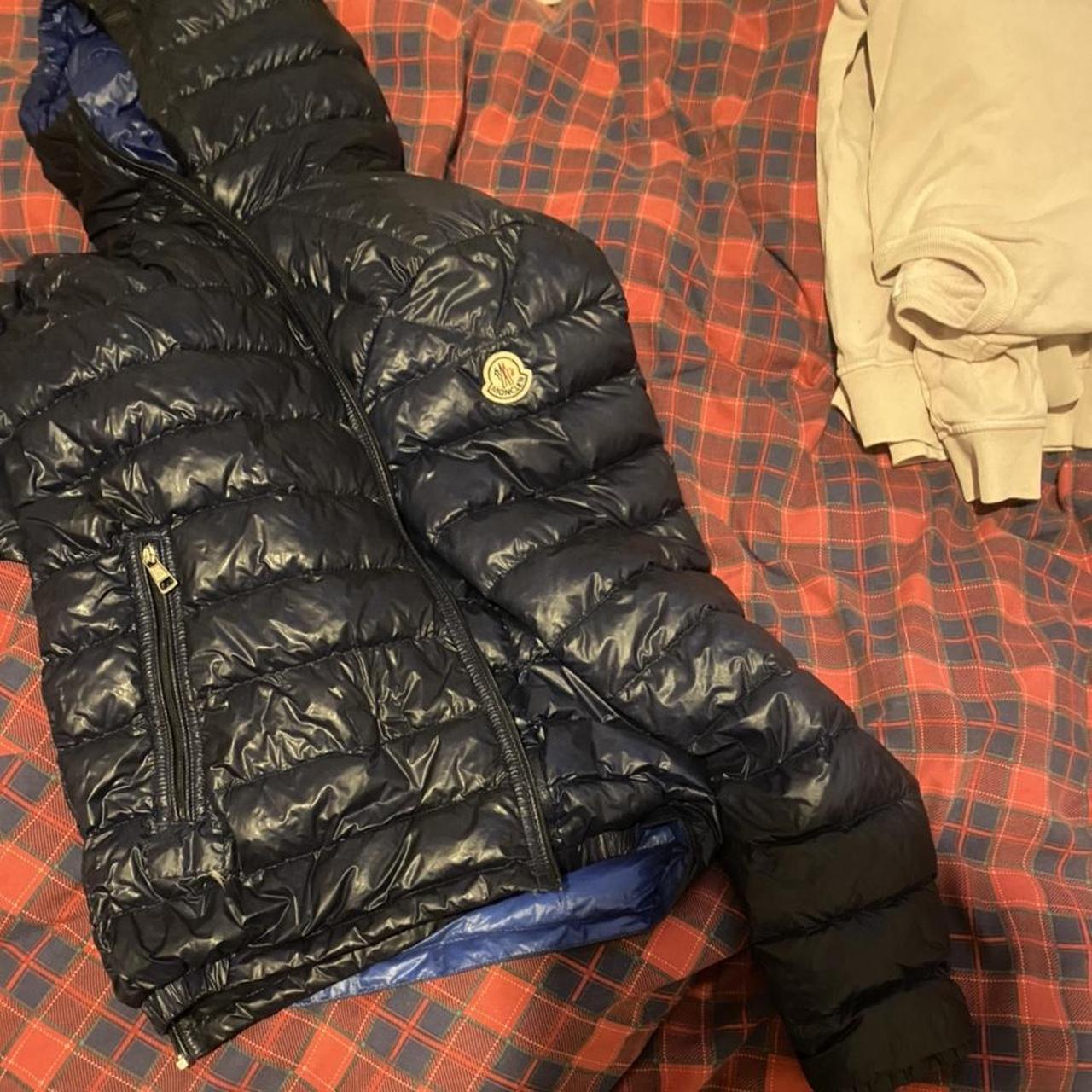 Moncler navy jacket badly damaged 3 repairs and zip... - Depop