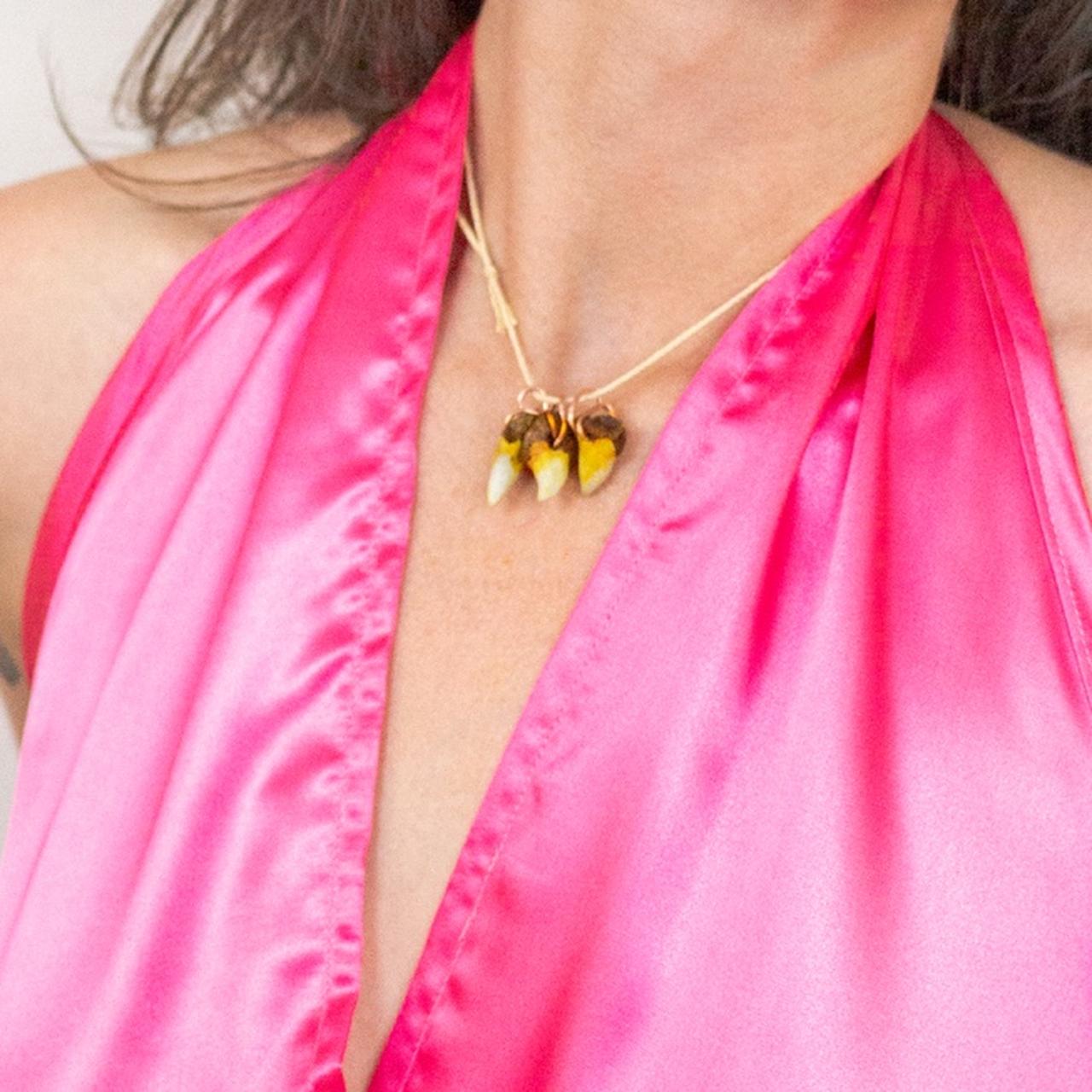 Creepy faux animal teeth wrapped in copper and... - Depop