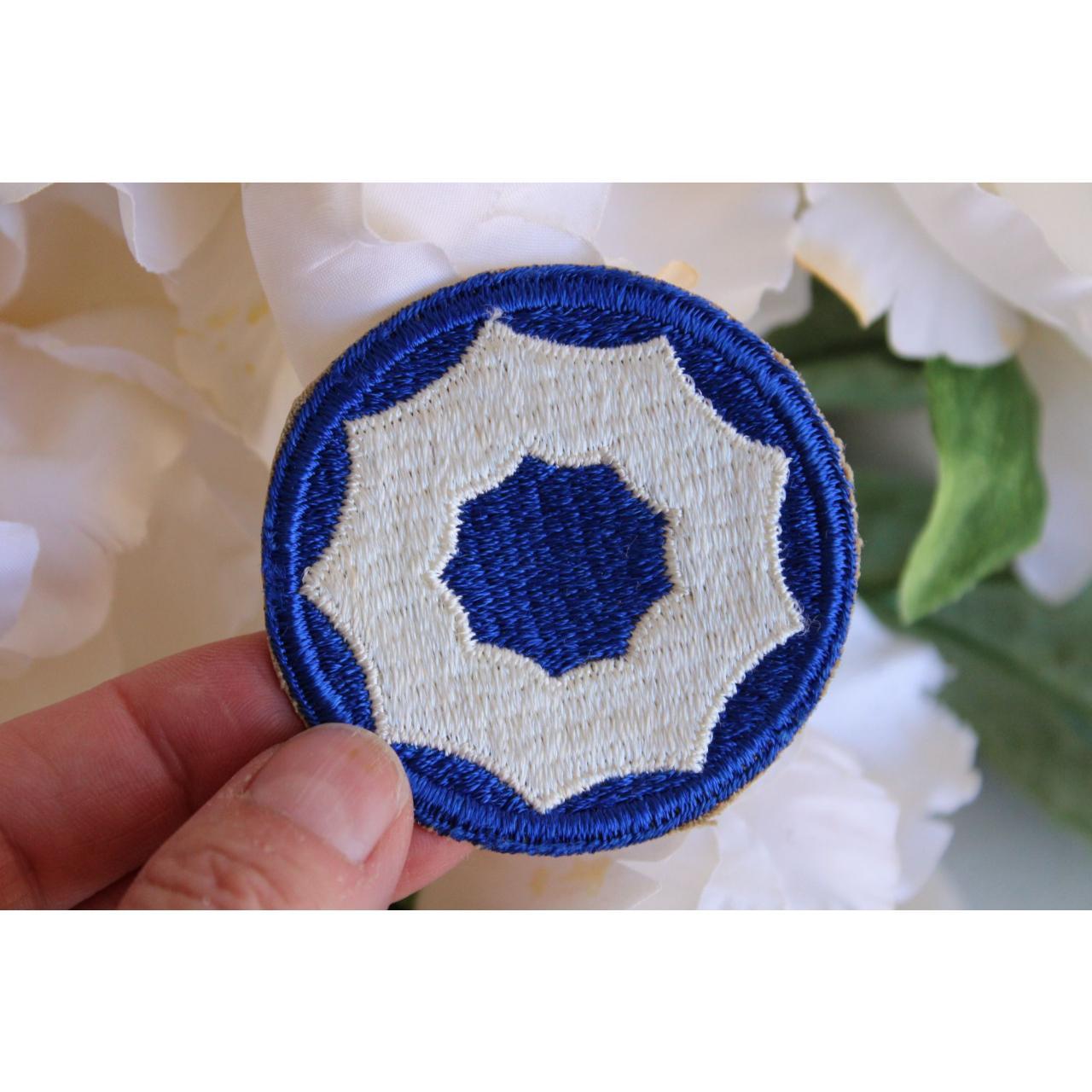 Military patch in blue with white shape in the... - Depop