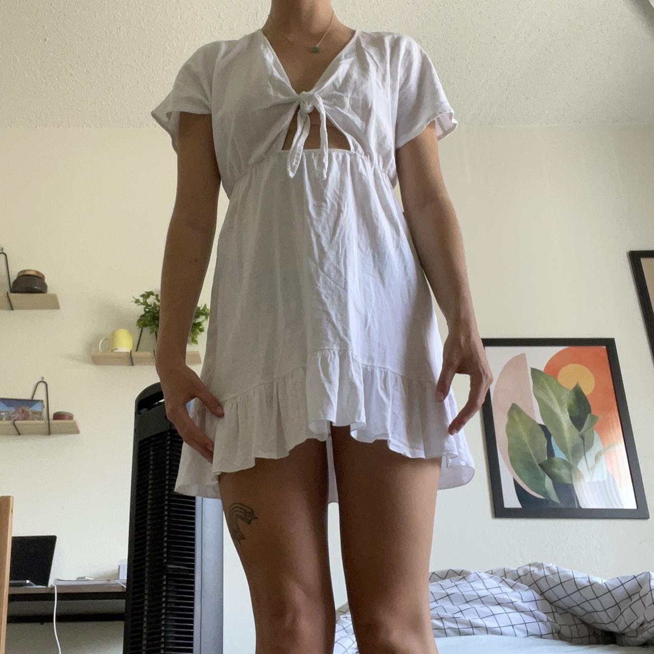 The cutest little dress that ties in front and has a... - Depop