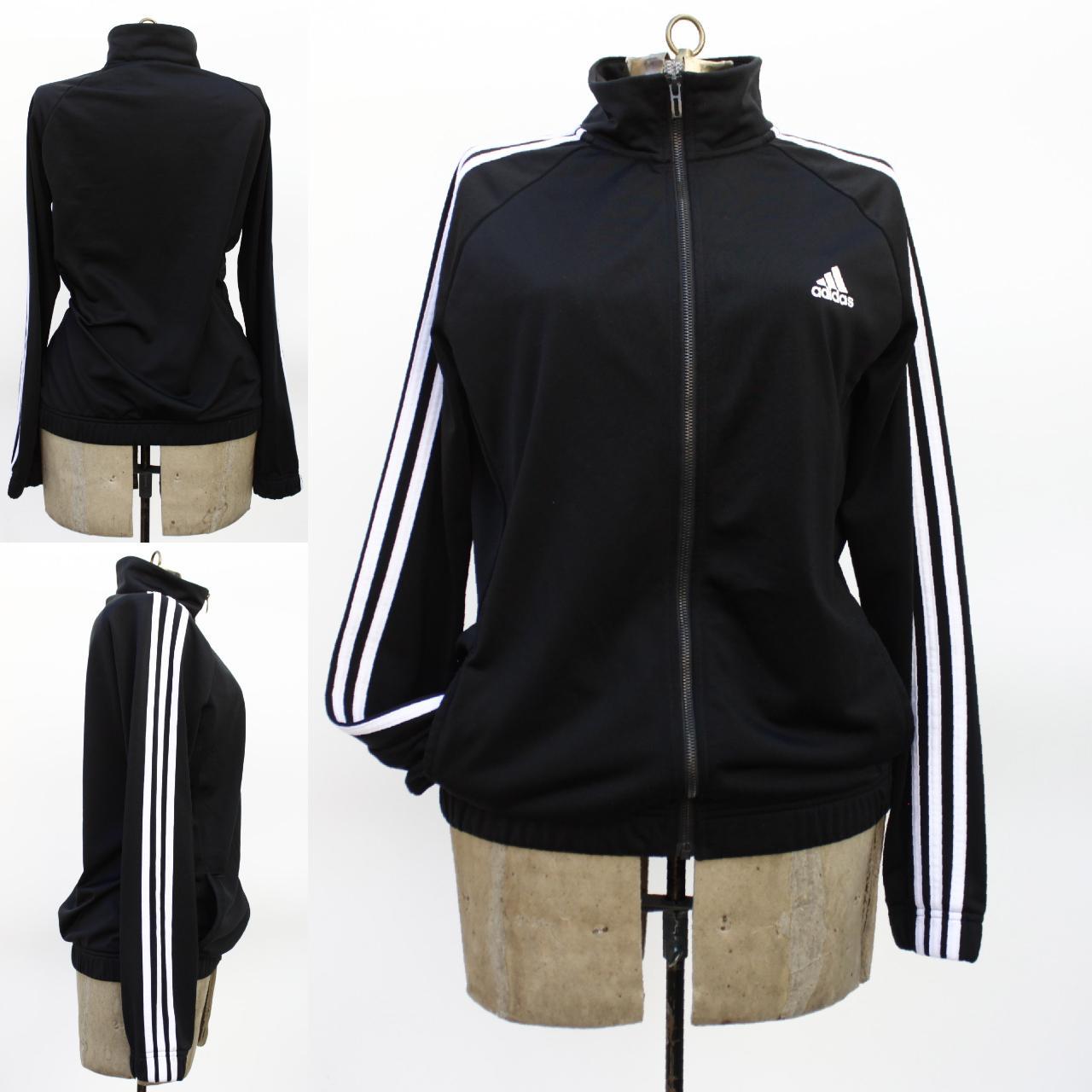 Women's black Adidas track jacket. White stripes on... - Depop