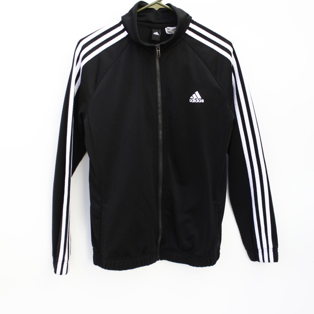 Women's black Adidas track jacket. White stripes on... - Depop