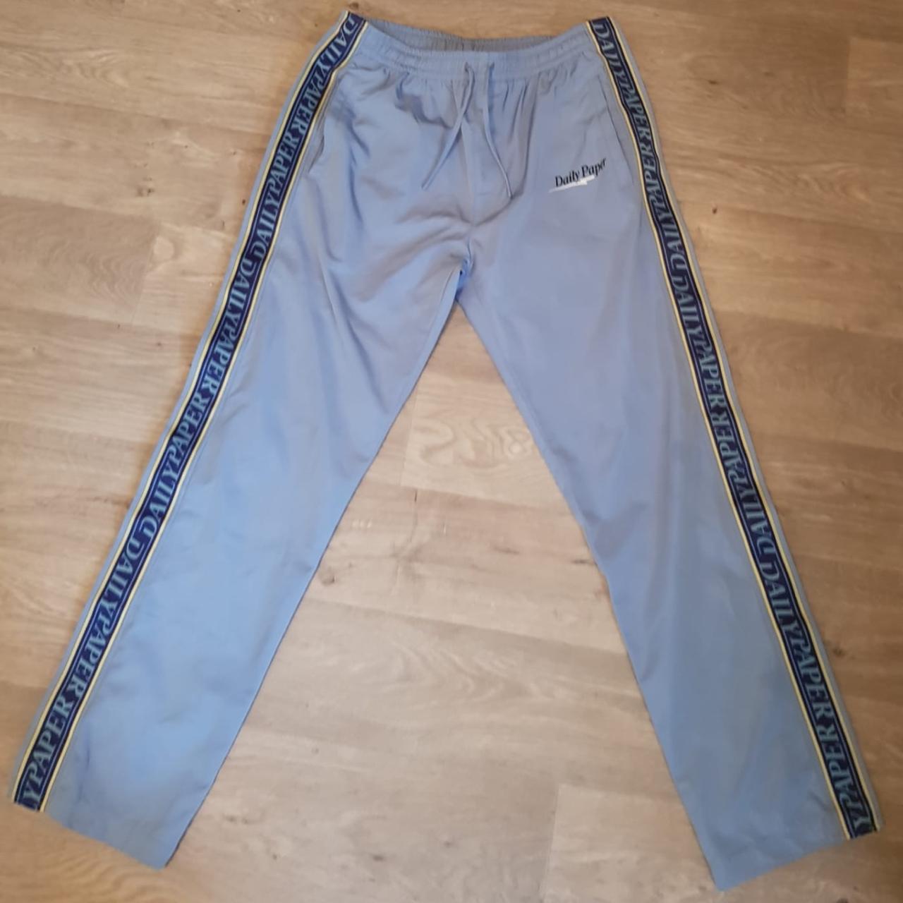 Baby blue daily paper popper tracksuit bottoms, with... - Depop