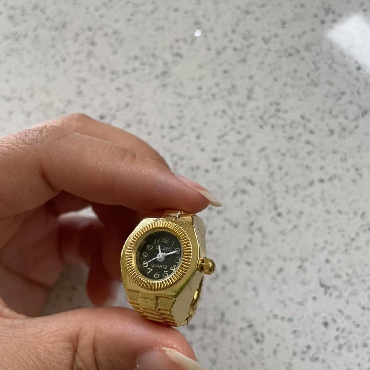 Gold watch ring with black face finger ring... - Depop