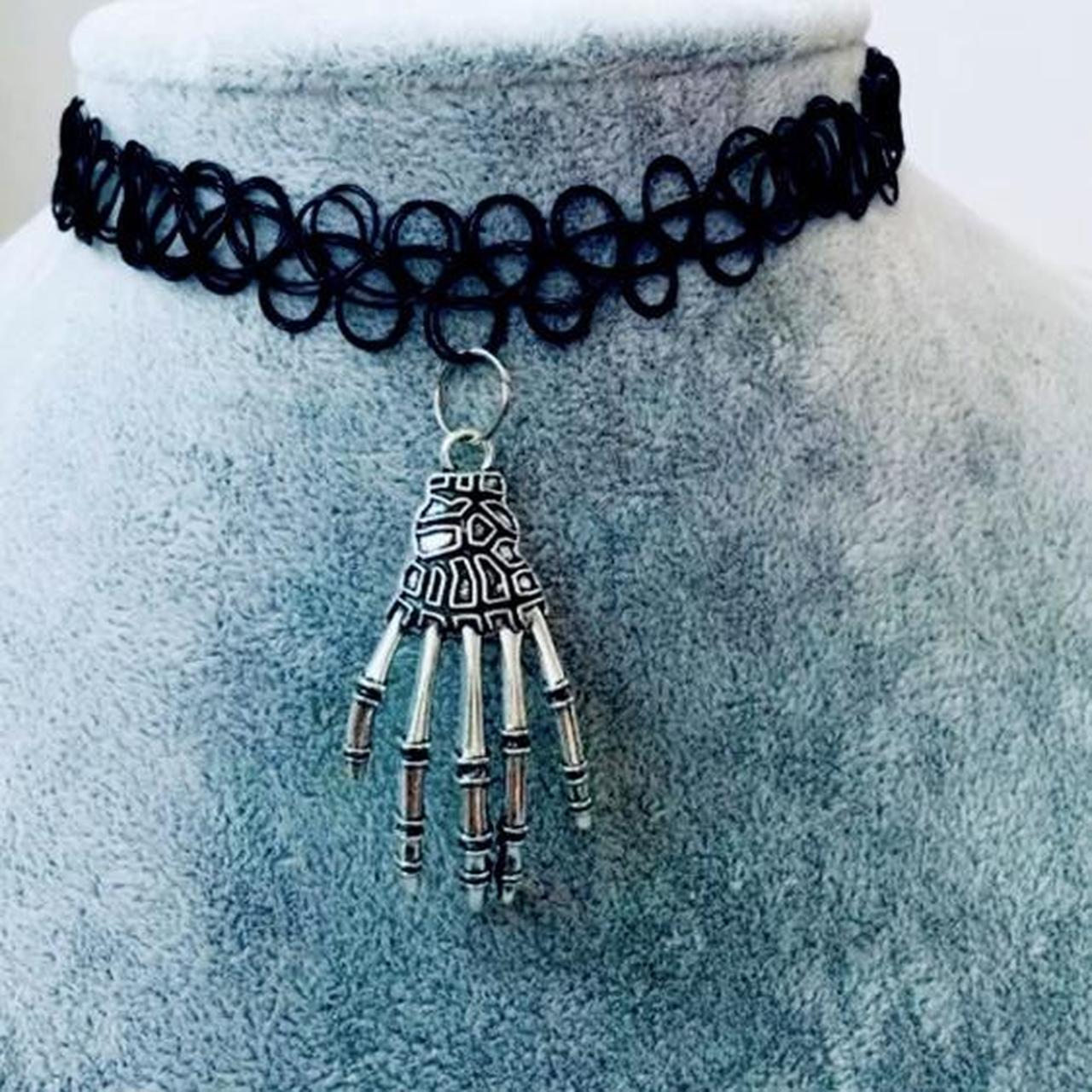 Skeleton hand choker necklace. Unisex. Necklace is... - Depop