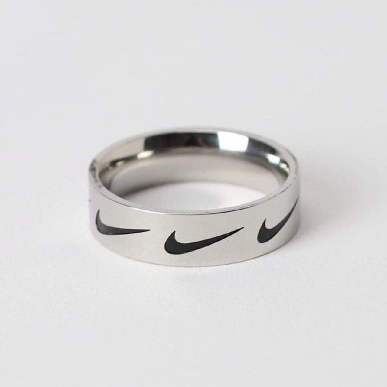Nike-Inspired Swoosh Repeat Logo Stainless Steel... - Depop