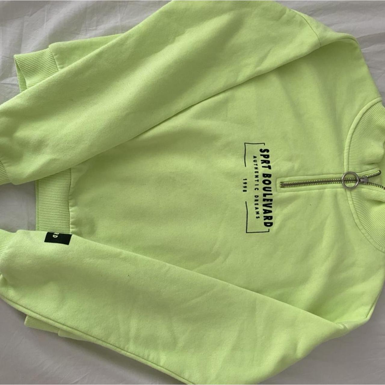 a neon yellow, kids quarter zip jumper that has... - Depop