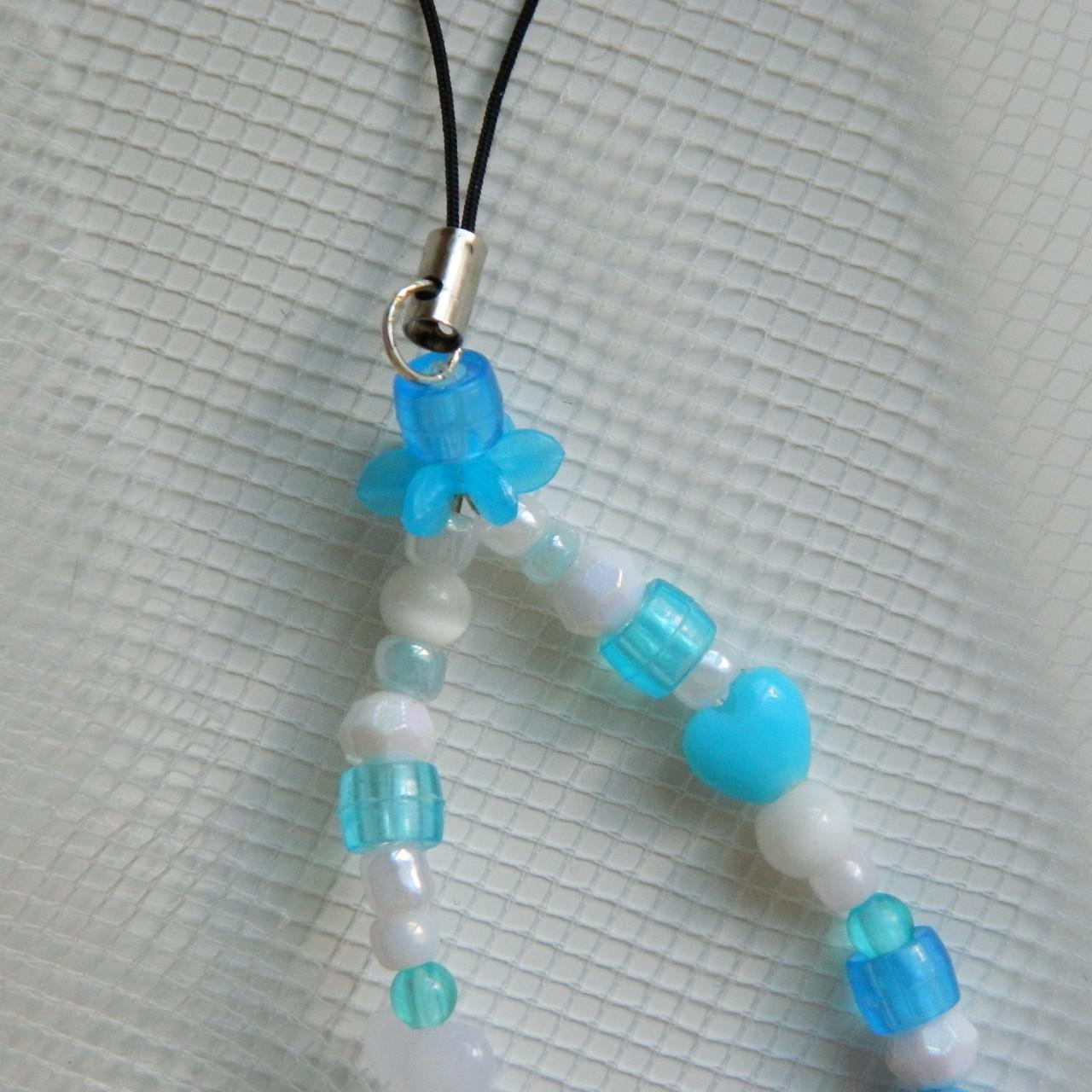 blue & white handmade phone charm 🐬 (this exact one... - Depop