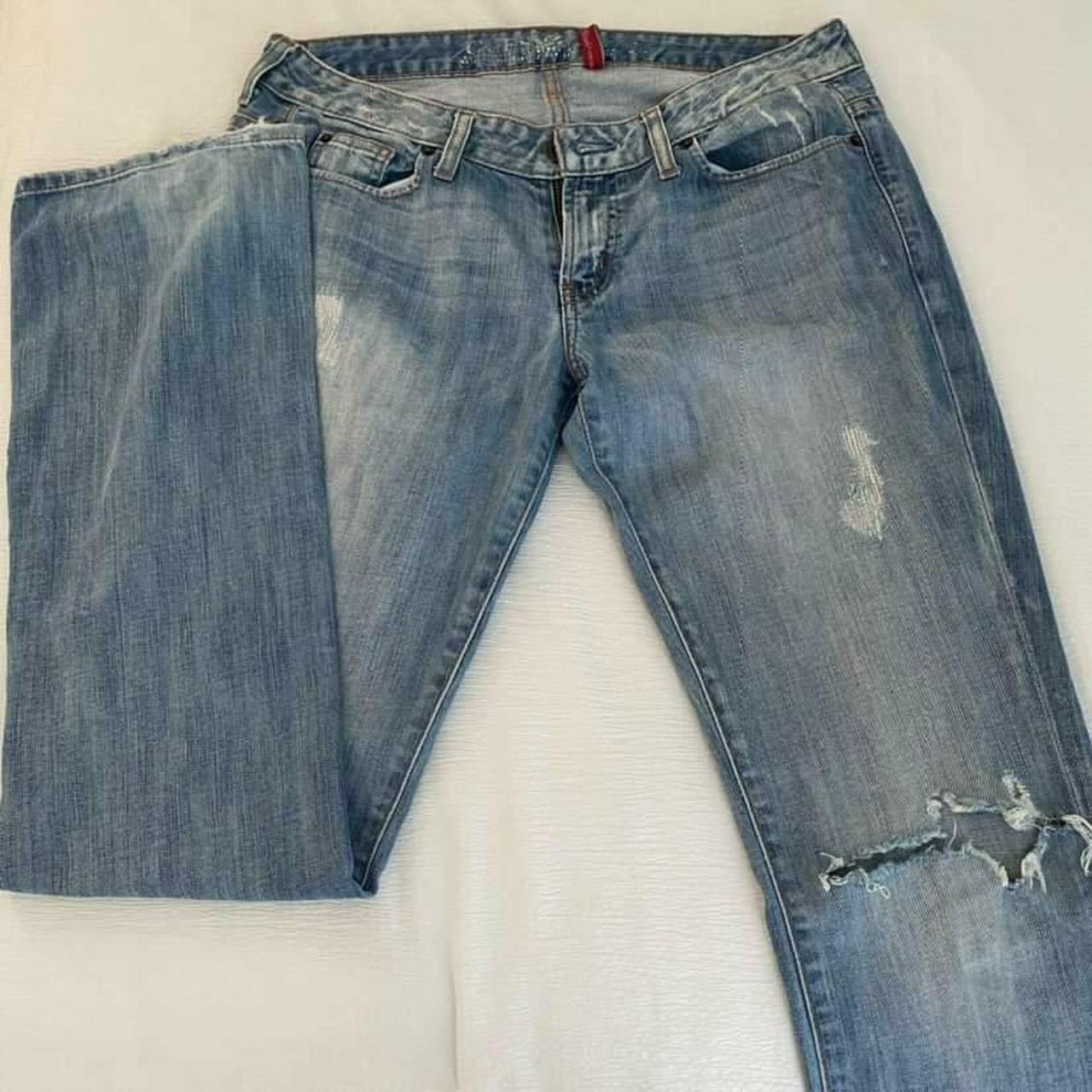 low waisted distressed jeans. tear on the knee. size... - Depop