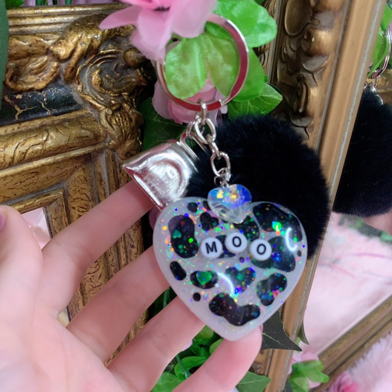 Black poofball & cow keychain. Super cute black... - Depop