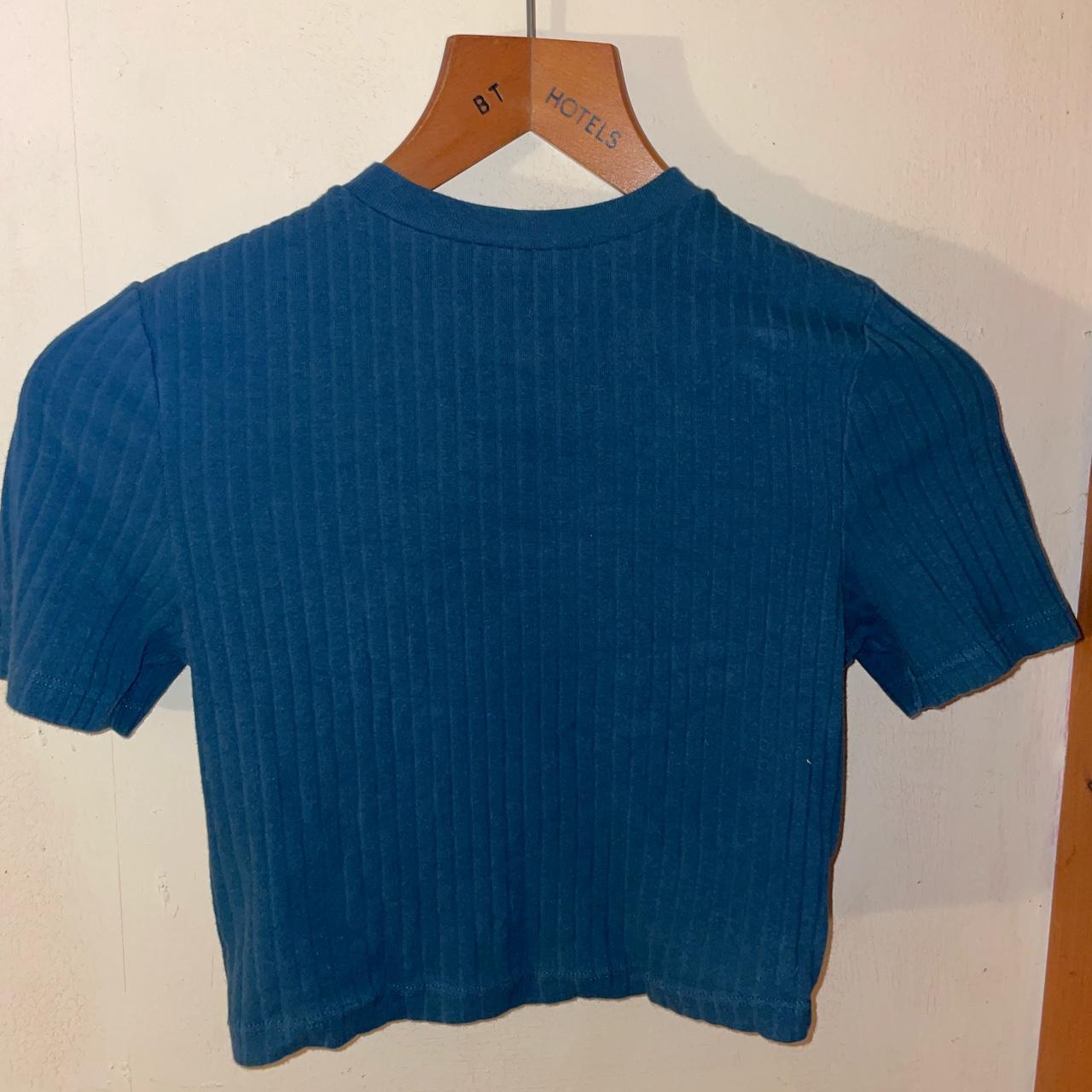Dark teal ribbed crop top with cut out detail on the... - Depop