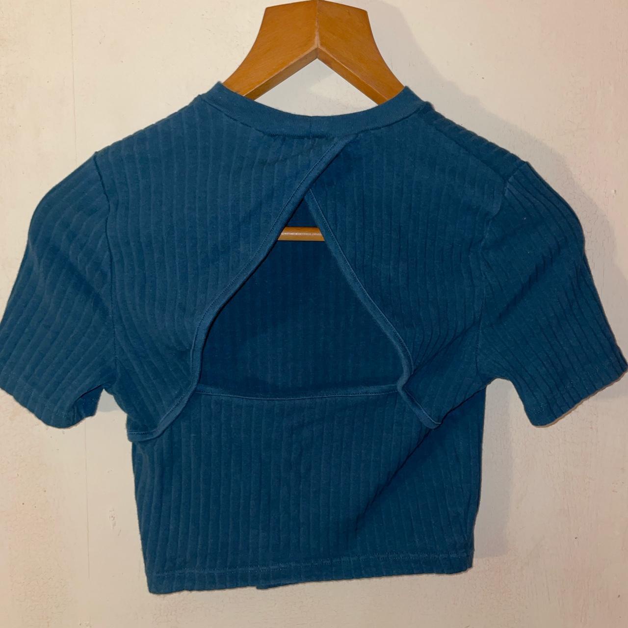 Dark teal ribbed crop top with cut out detail on the... - Depop